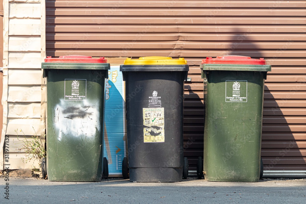 green, red and yellow bins for recyclable and non-recyclable items ...