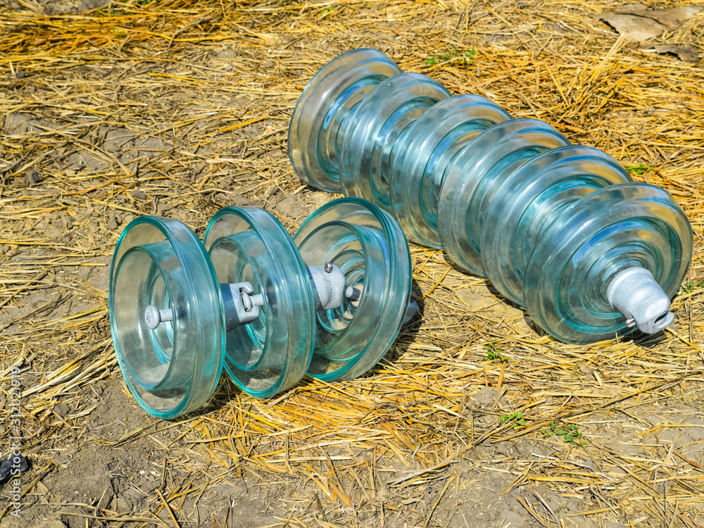 Foto de Stock High-voltage insulators of glass insulators. Installation ...