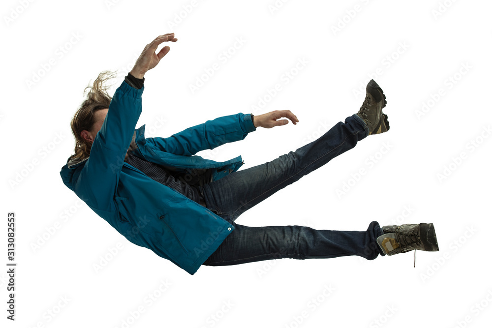 A second before falling. Caucasian young man falling down in moment ...