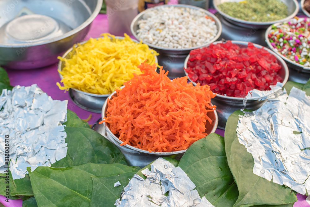 Banarasi pan and meetha pan garnished with betel nut and other ...