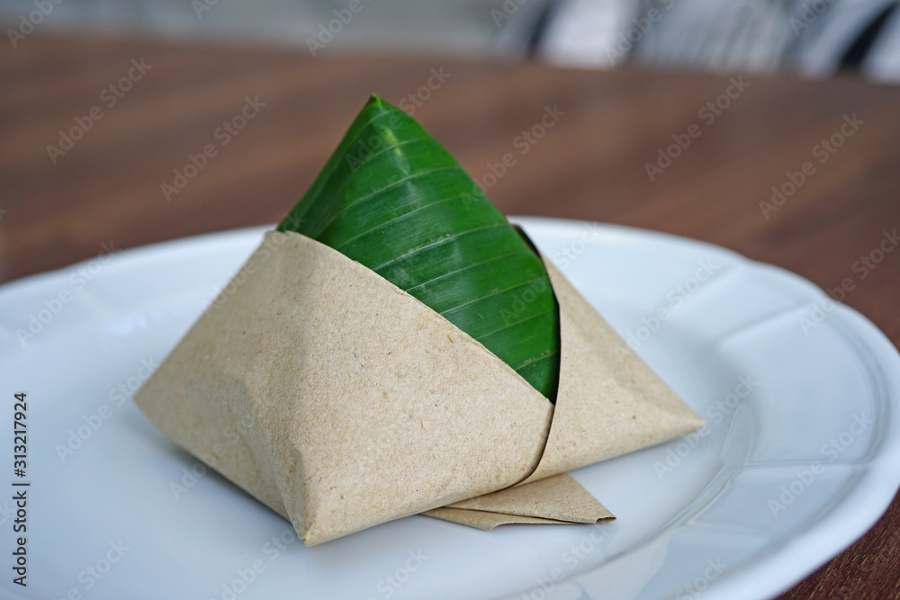 Pyramid of Malaysian Nasi Lemak fragrant rice wrapped in pandan leaf ...
