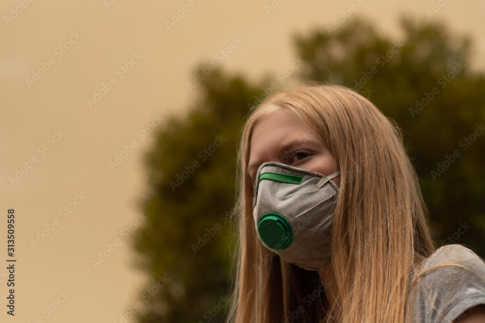 Australian bushfire: blond girl wearing P2 N95 protection respiratory ...