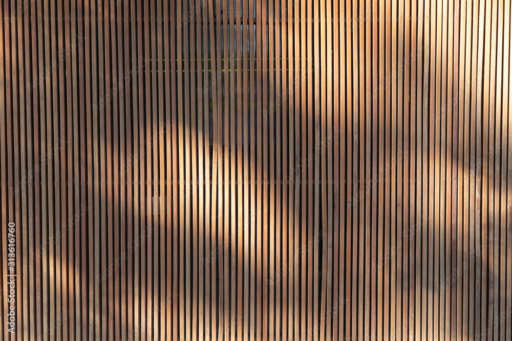 light and shadows on outdoor wooden battens background and texture ...