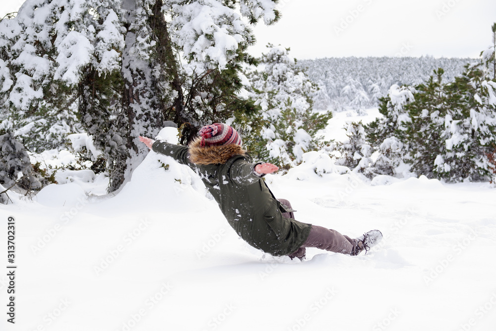 Young man slipped and lost his balance during a walk at forest in ...