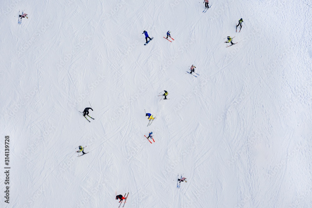 Aerial drone view on skiers on ski slope at winter. Stock Photo | Adobe ...