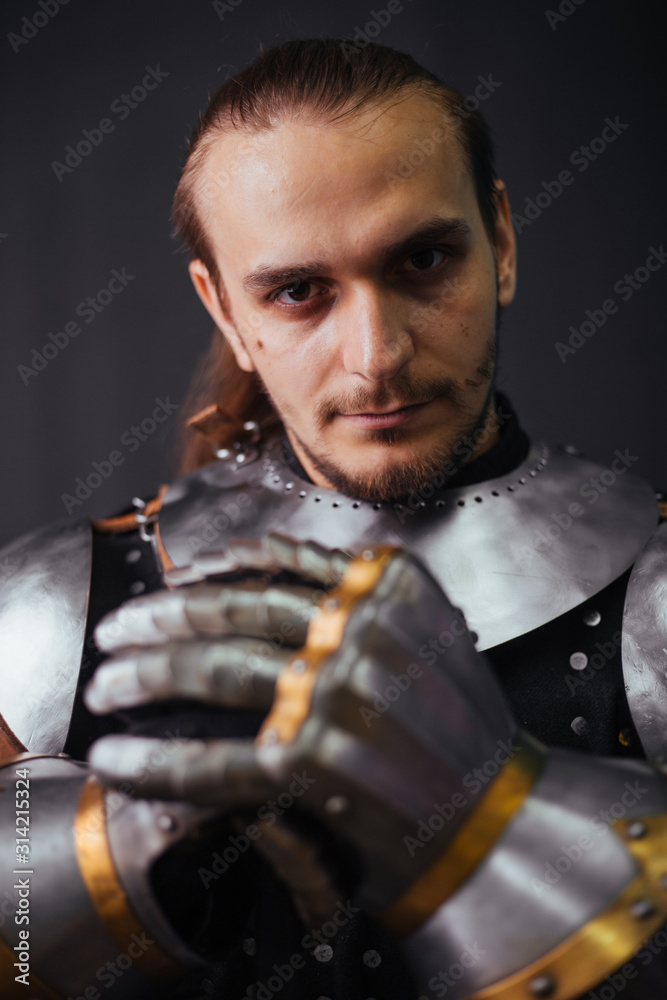 Portrait of a medieval knight with a two-handed sword. Warrior in the ...