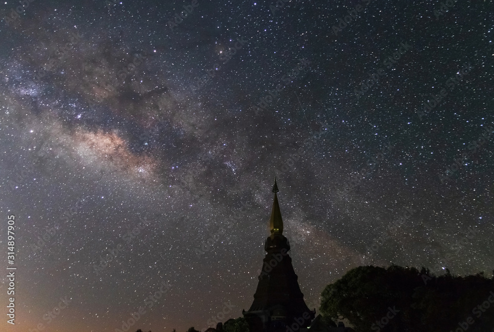 Milky way galaxy with stars on night sky ; silhouette of The Great Holy ...