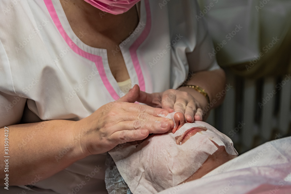 Non-invasive face carboxytherapy in a beauty salon. It is performed for ...