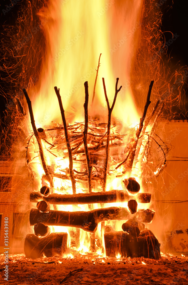amazing blur effect of a violent bonfire of fire in a village in the ...