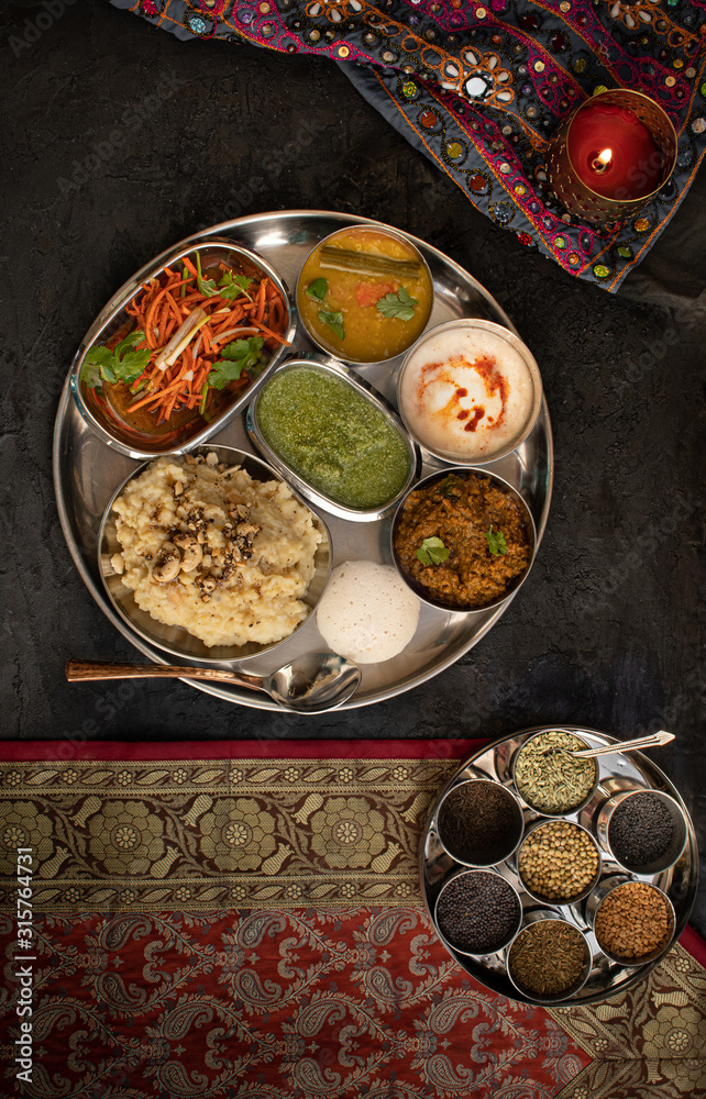 South Indian vegetarian thali with pongal, sambar, chutney and side ...