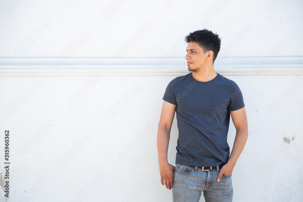 Hispanic man in colonial and historical city - posing on a white wall ...