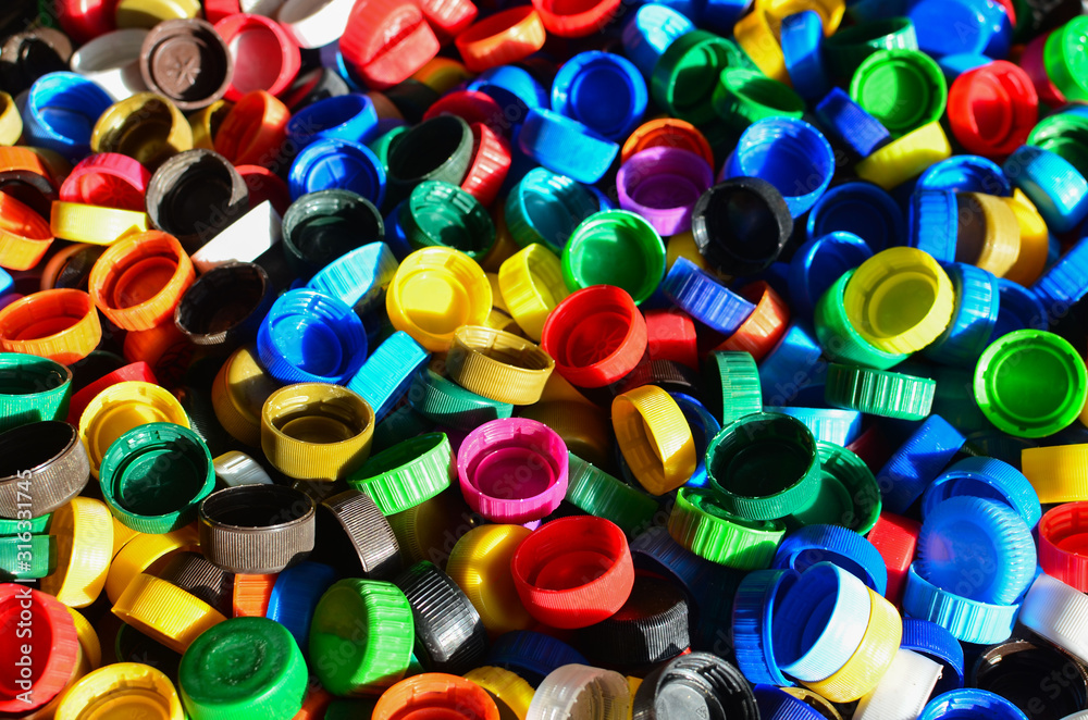 Plastic bottle caps background. Cap material is recyclable.Remove lids ...
