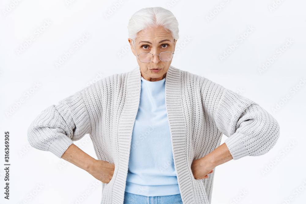 Foto de Stock Strict serious-looking displeased old woman, grandmother ...