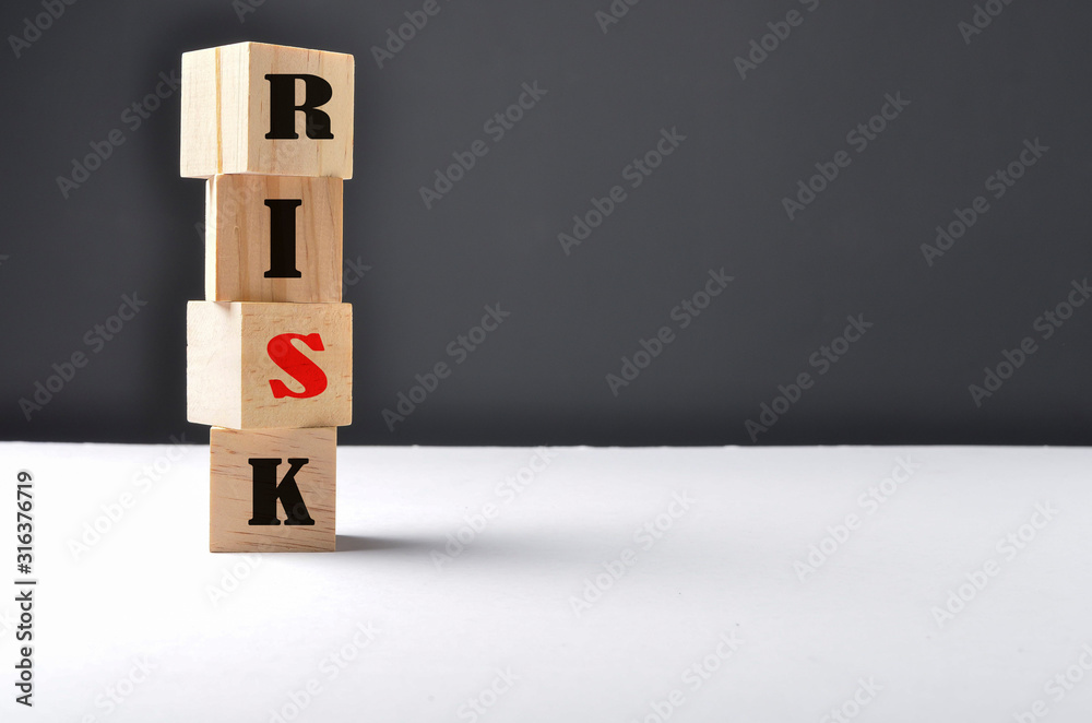 RISK word written on wooden cubes. Financial risk assessment, risk ...