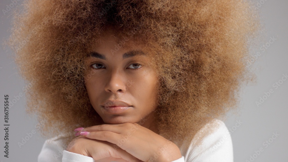 Mixed race black woman with big afro hair without makeup with ideal ...