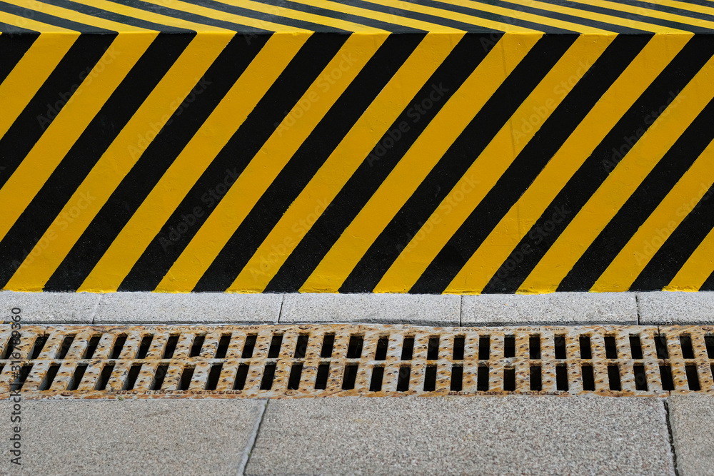 Striped Yellow Black Caution Pattern Over Grungy Concrete Roadside ...
