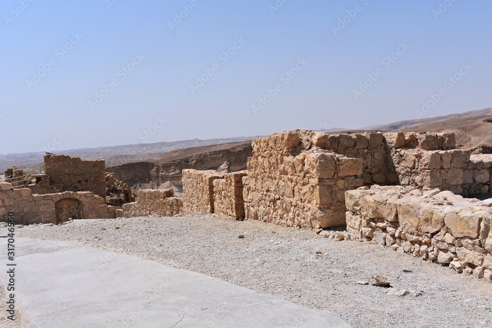 Ruins of the ancient Masada, a mountaintop fortress, near the Dead Sea ...