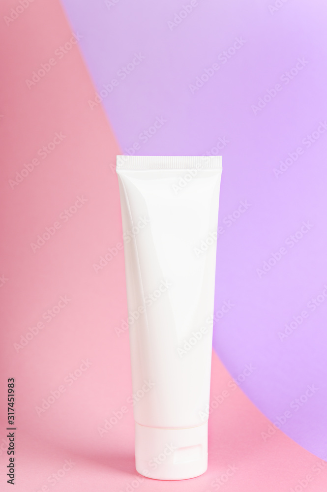Feminine hygienic product tube on pastel pink and lilac background ...
