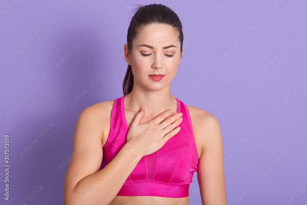 Close up portrait of beautiful young woman with sore throat, isolated ...