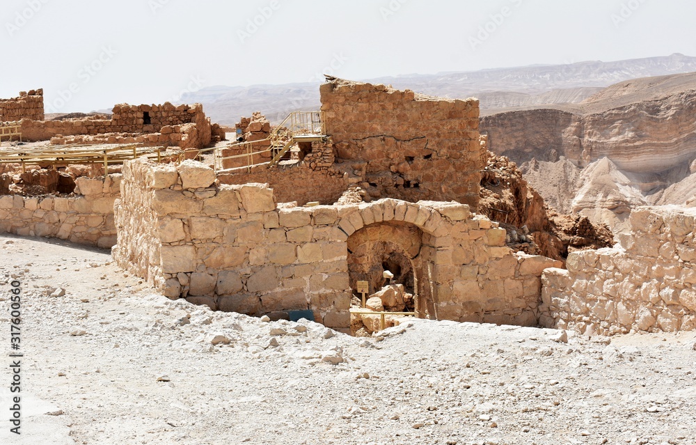 Ruins of the ancient Masada, a mountaintop fortress, near the Dead Sea ...