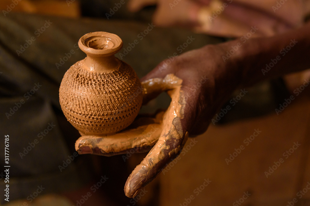 Indian potter making clay pots on pottery wheel in Pottery town is old ...