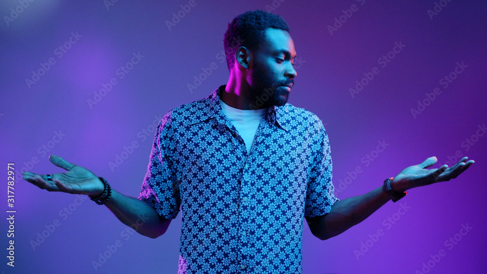 Young Afro American attractive man with widely opened eyes having ...