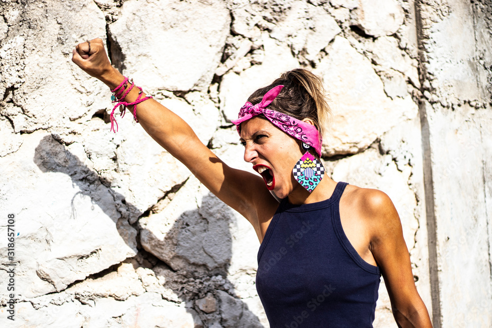 Profile view of a beautiful young and strong woman activist and ...