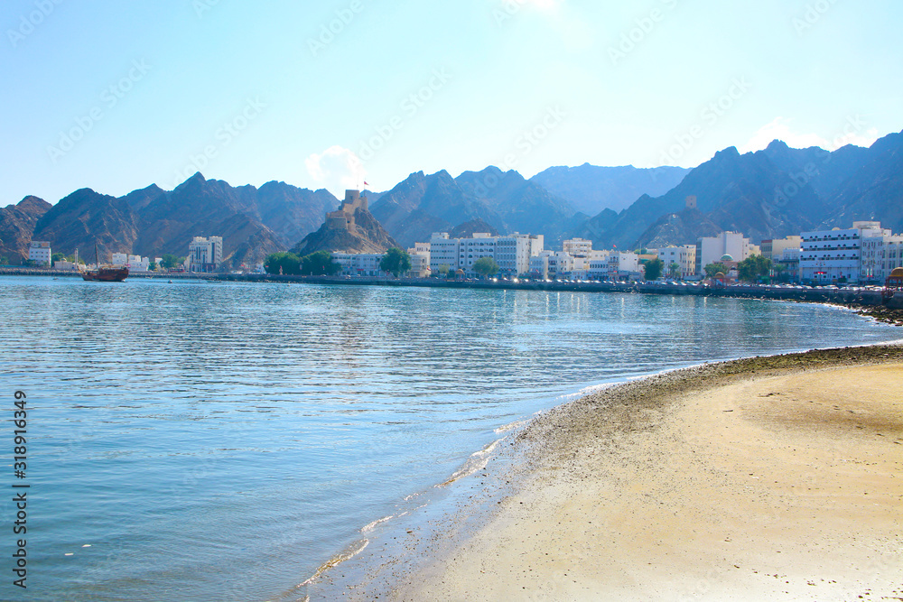 Waterfront of the city of Muscat, Oman, with buildings in the ...