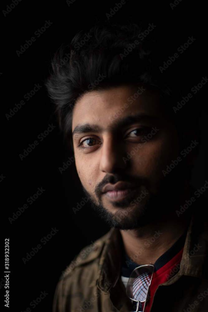 Fashion portrait of young and handsome Indian Bengali brunette man with ...