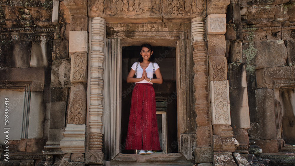 Beautiful, pretty, young Thai girl is exploring the ancient ruins of ...
