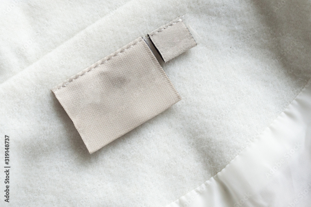laundry care clothing label on fabric texture Stock Photo | Adobe Stock