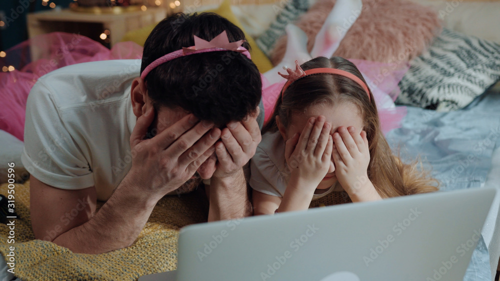 High angle front view scared father and daughter closing their eyes ...