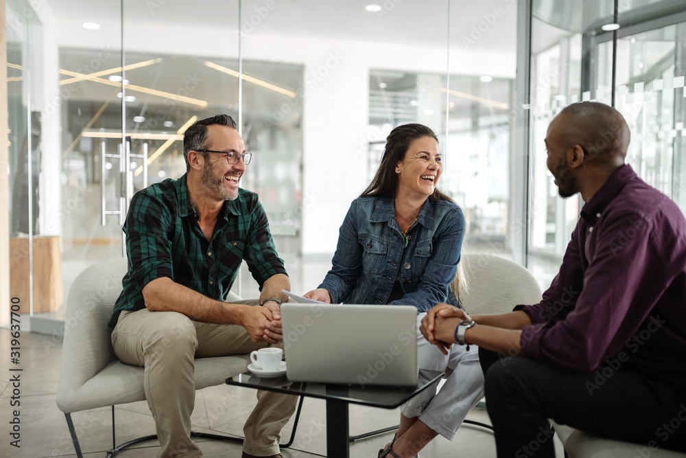 Candid real meeting of diverse successful business team smiling and ...