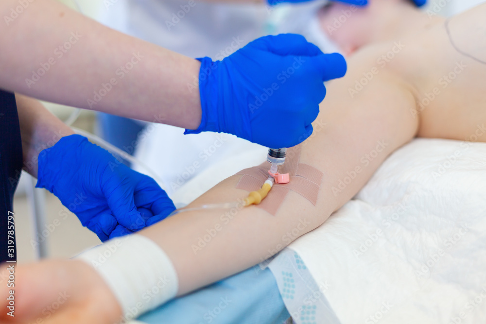 Hospital. Surgeon operates in the operating room. Insertion of a ...