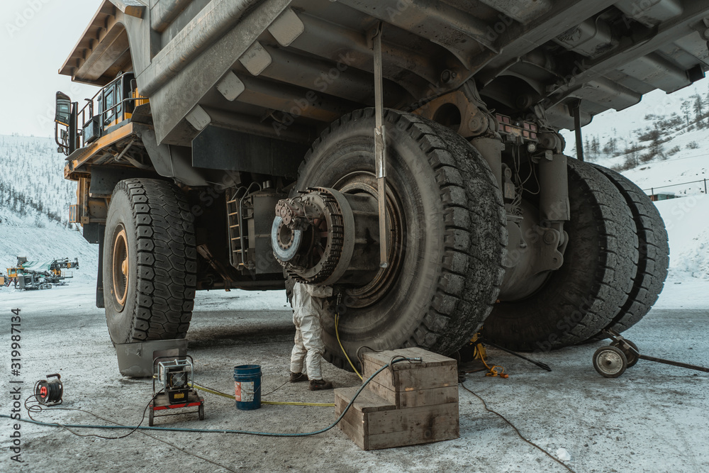 Repair of a mining dump truck at the gold mine site. Stock Photo ...