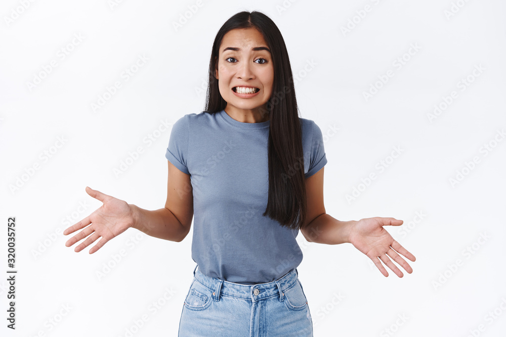 Awkward and embarrassed cute silly asian girl making mistake ...