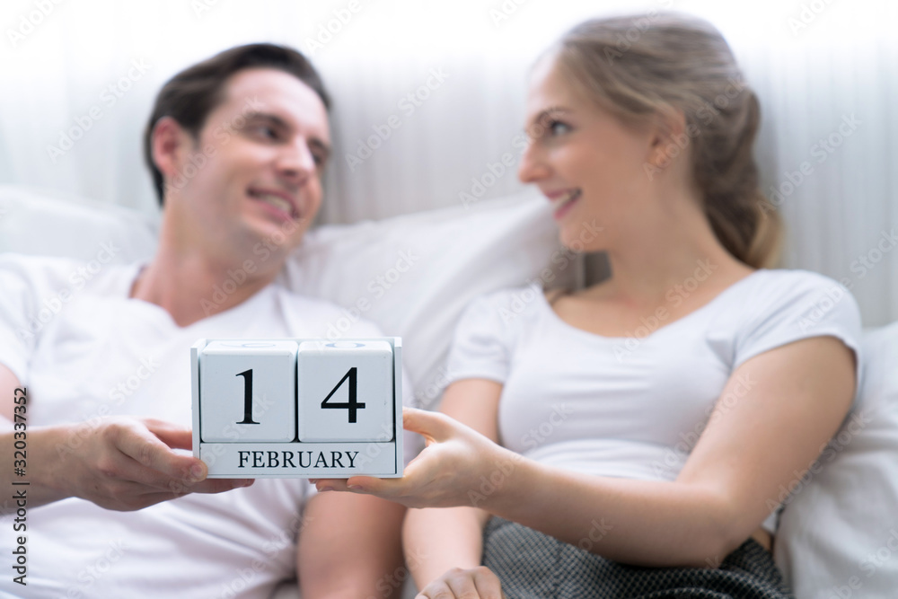 Couple on Valentine's Day, Romantic couples sitting on the bed in the ...