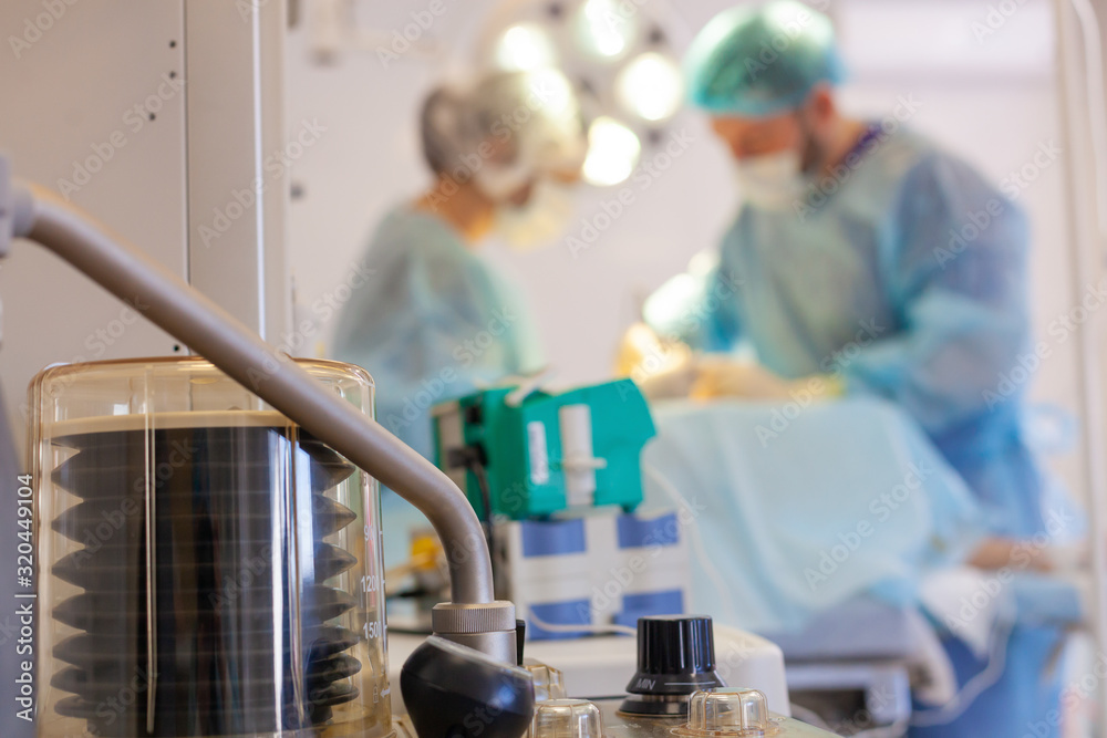 Hospital. Surgeon operates in the operating room. Lung ventilator and ...
