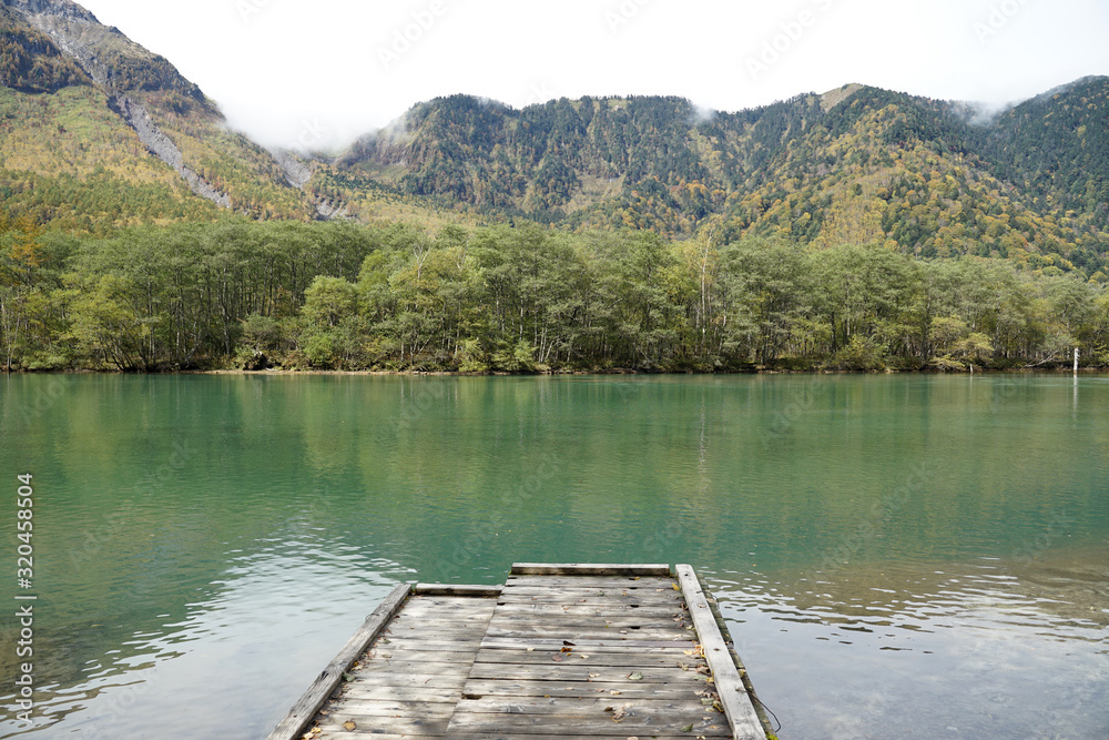 Beautiful crystal clear water landscape at Taisho pond with mountain ...