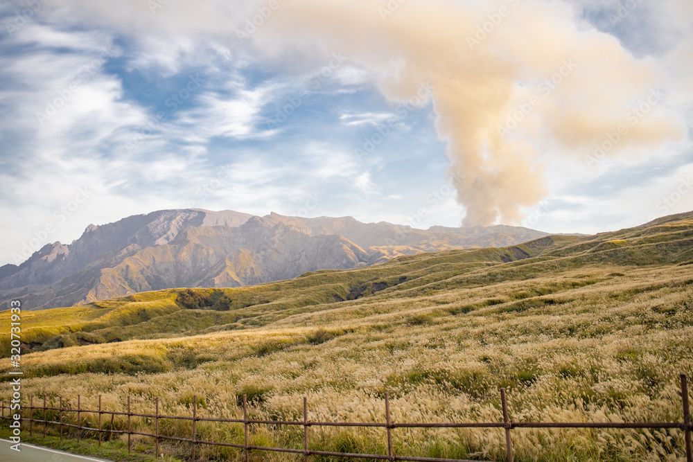 Area of Aso active volcano background with smoke at Mount Aso Nakadake ...