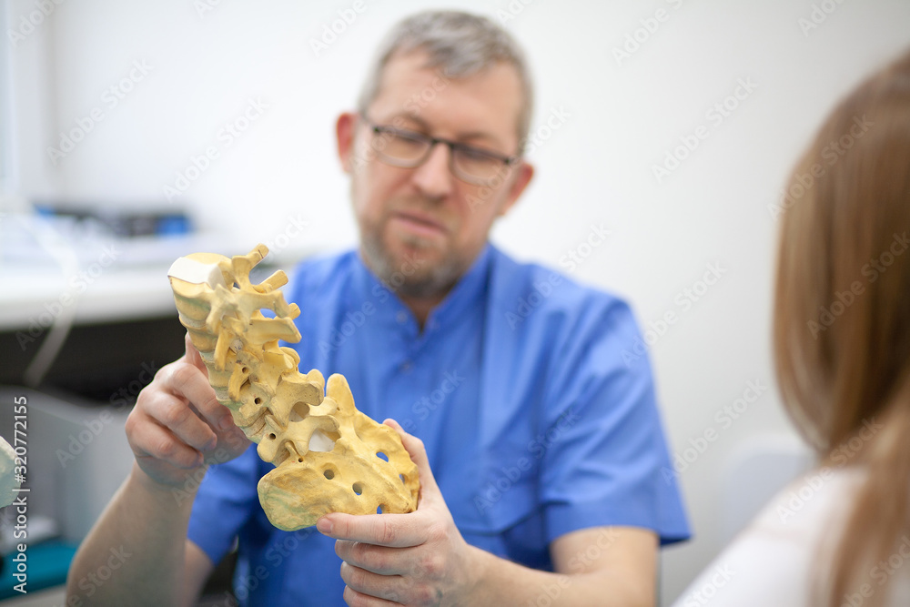 The doctor osteopath and chiropractor in the hospital explains to the ...