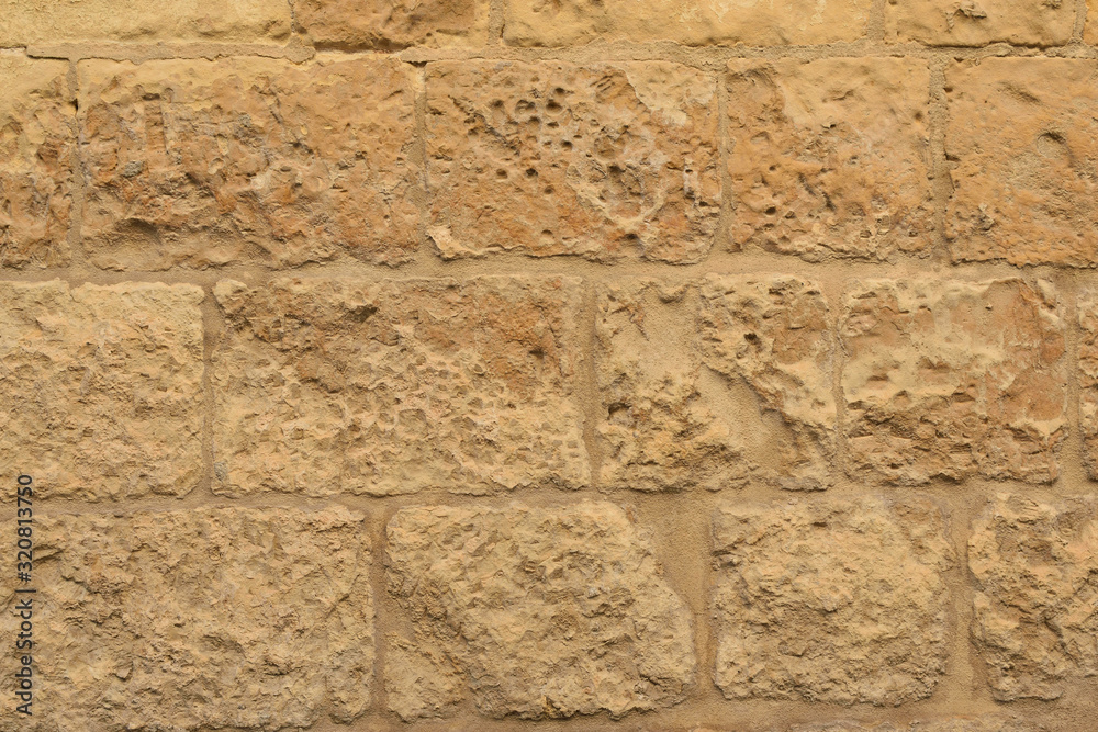 Limestone wall of a traditional medieval Maltese house Lija village ...