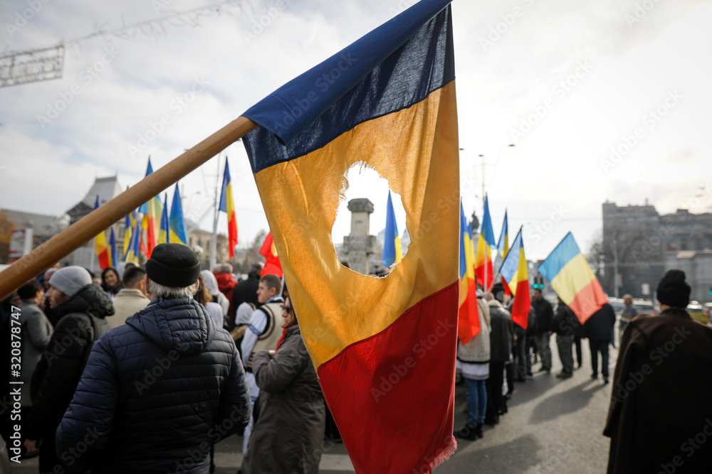 Details with the Romanian flag with a hole, the symbol of the Romanian ...
