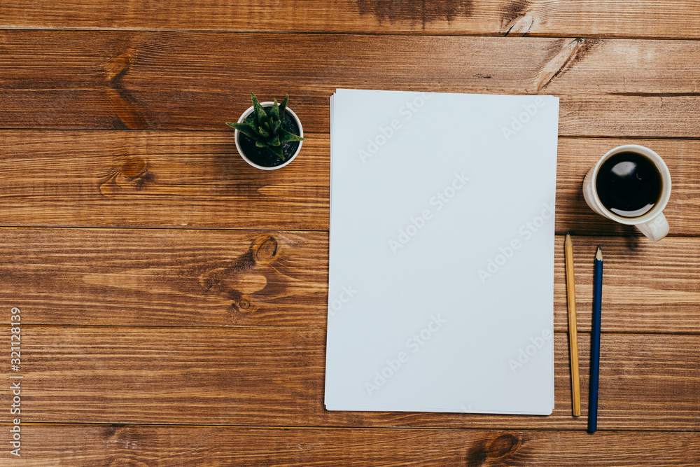A4 blank paper, cup of coffee on wooden table background. Blank ...