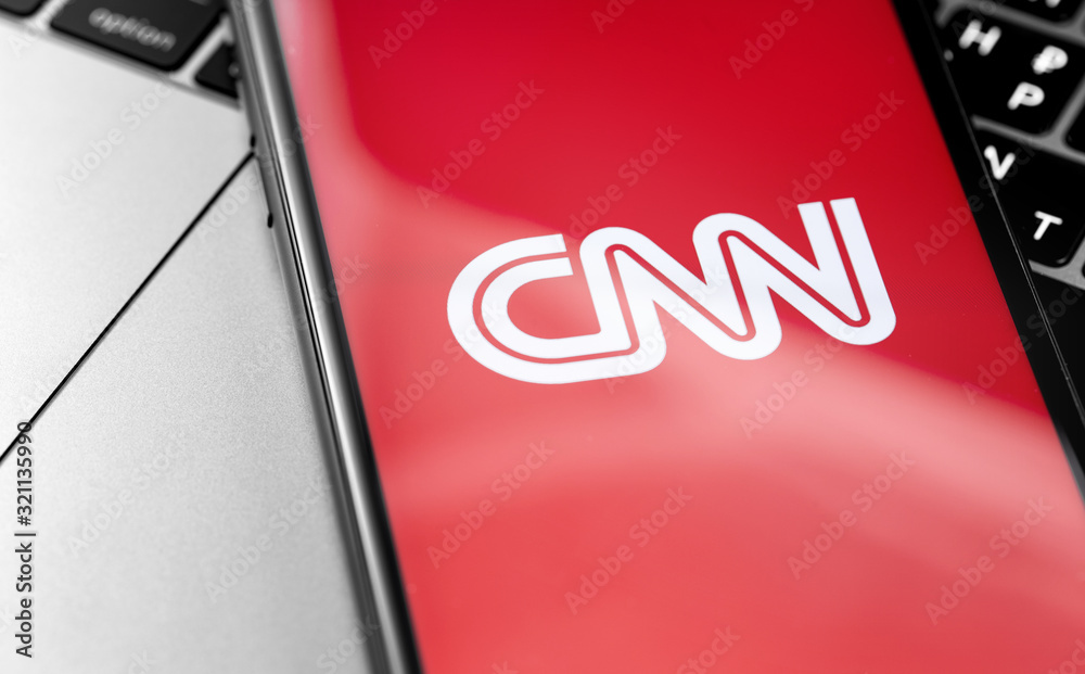 CNN logo on the screen smartphone. CNN is a television channel created ...