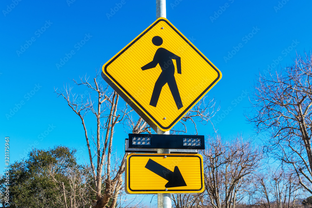 Pedestrian crossing sign with flashing lights. Crosswalk beacon ...