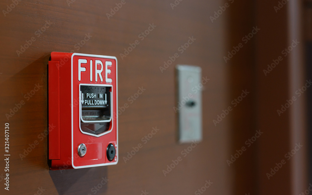 Fire alarm switch on wooden wall with copy space. warning and security ...