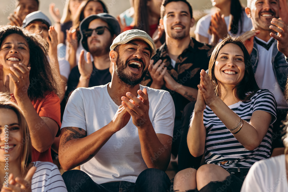 Excited fans cheering their team Stock Photo | Adobe Stock