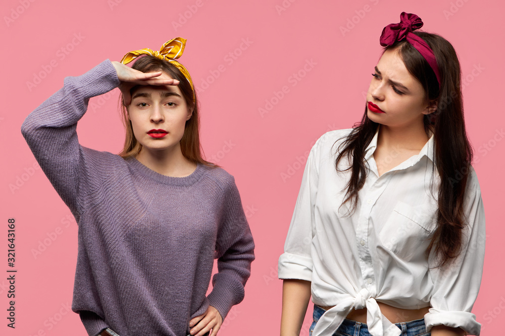 Body language. Side view of attractive young woman having sad or ...