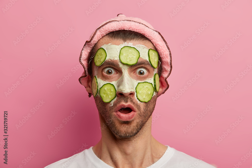 Shocked male model stares with wide opened eyes and mouth, has bristle ...